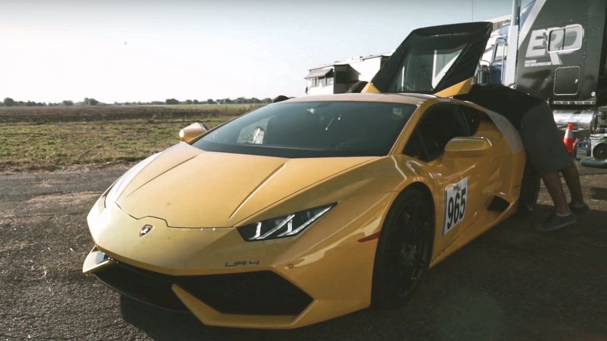 Watch two Lamborghinis plow a field during a drag race at 200 MPH